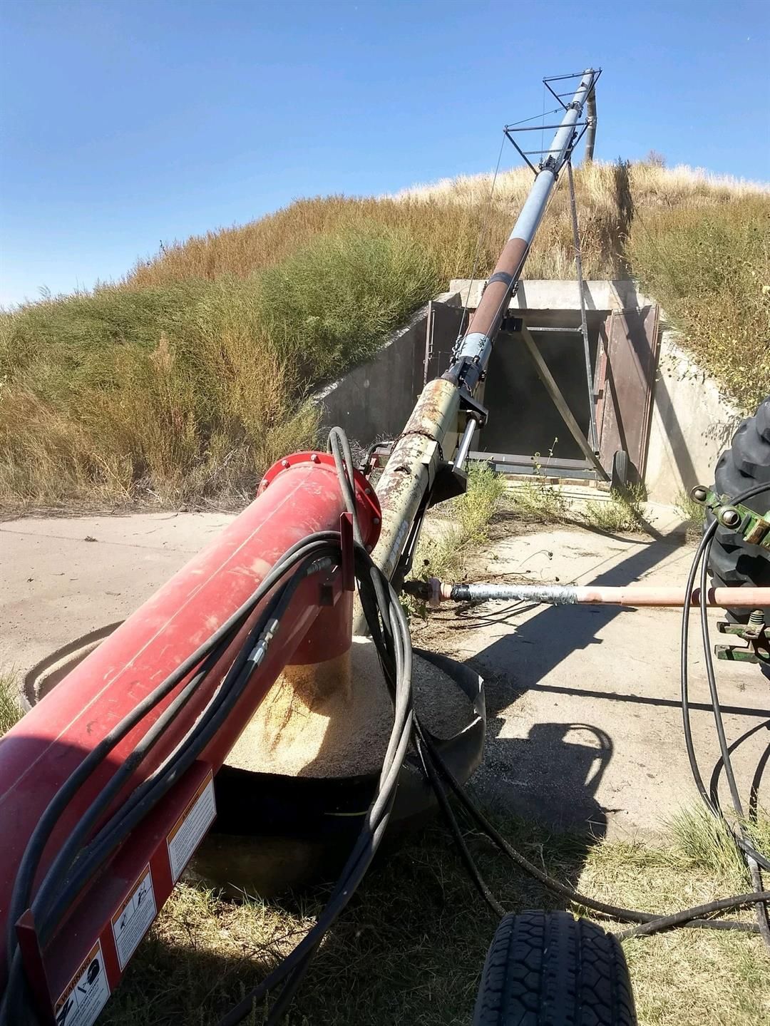 Western Nebraska farmers using World War II bunkers for grain storage ...